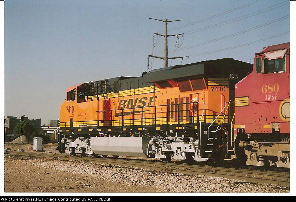 BNSF 7410 and BNSF 680 nose as they roll south to C Springs, Co.